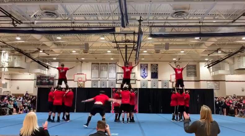 Heartwarming video shows cheer dads supporting their daughters with an ...